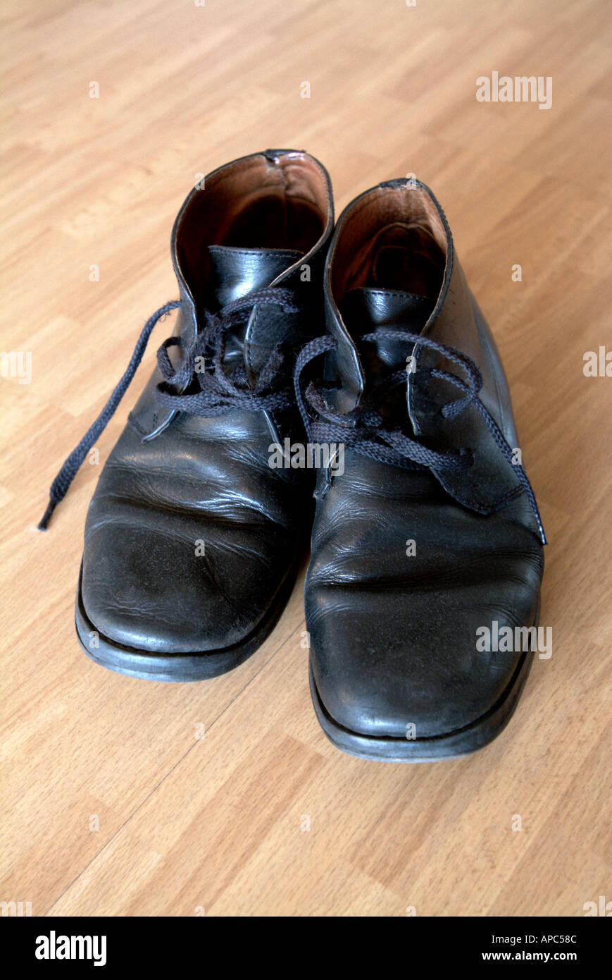 Old black leather work boots hi-res stock photography and images - Alamy