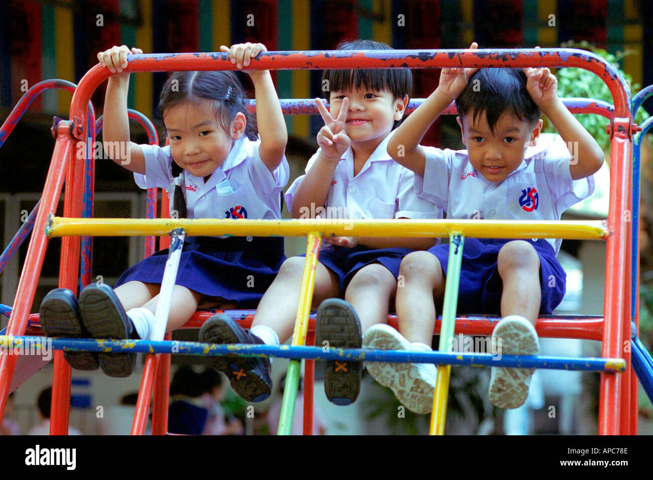 Group of kindergarten students are playing happily in the playground ...