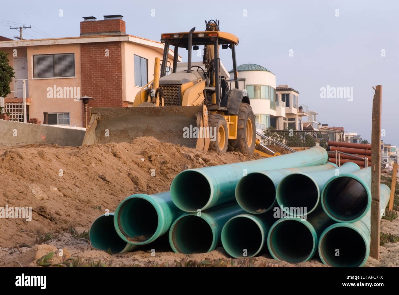 Bulldozer with water pipes Stock Photo - Alamy