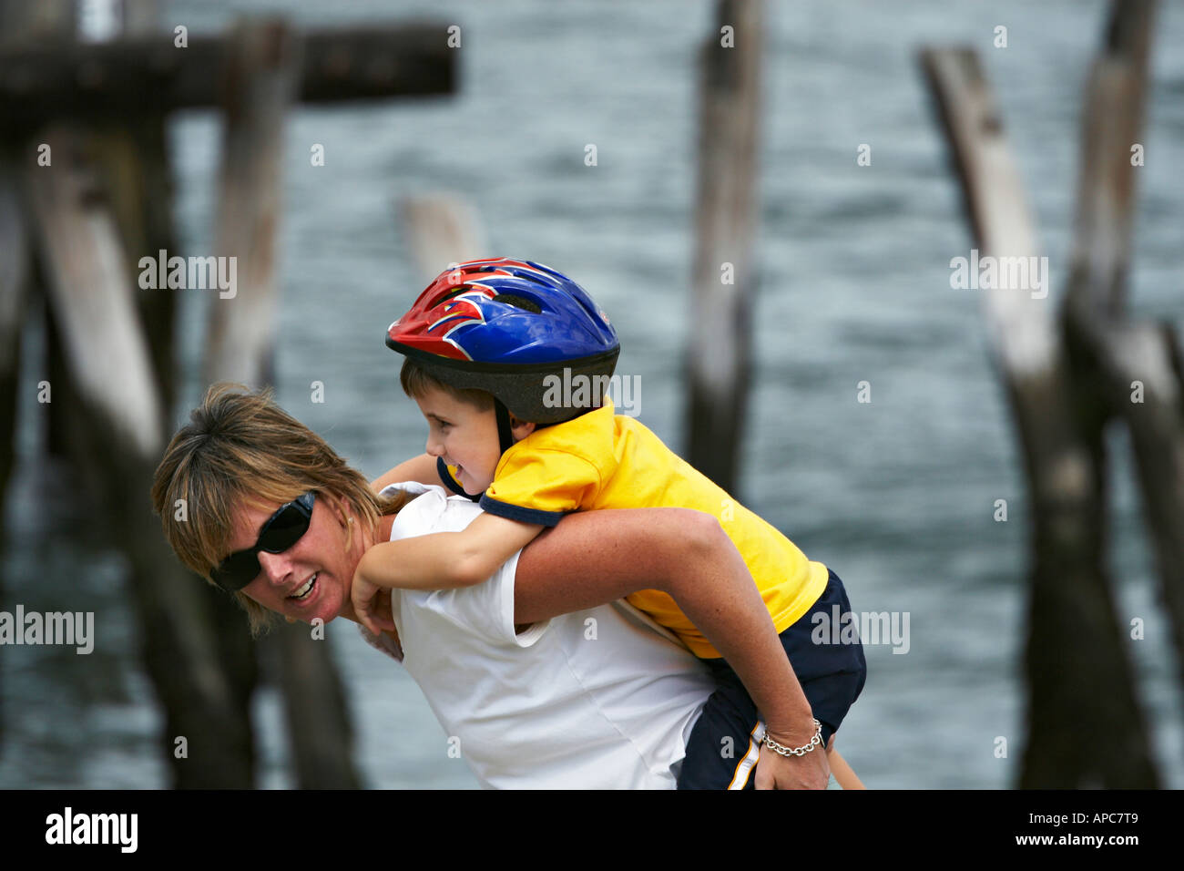 Mother carrying children on back hi-res stock photography and images ...
