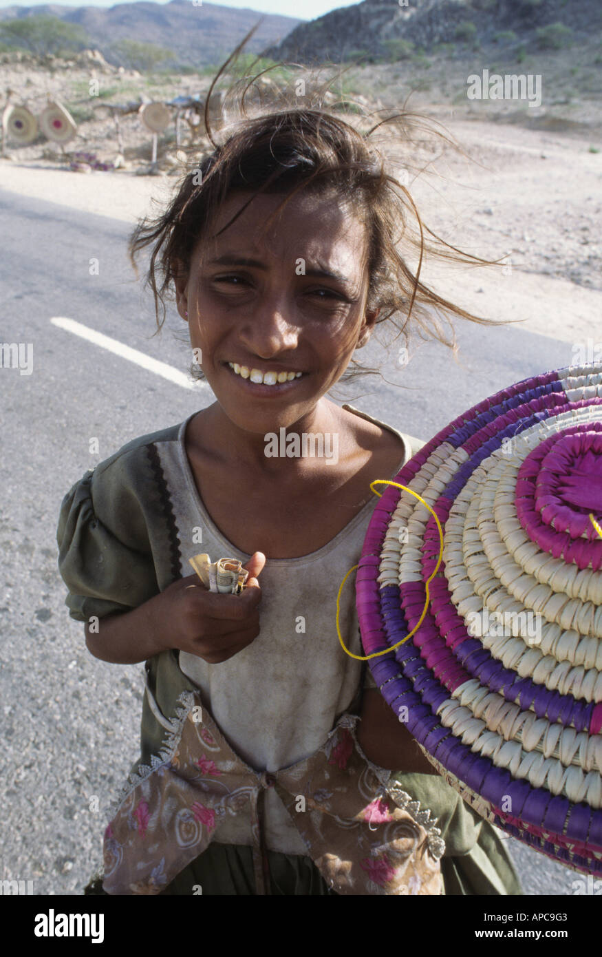 young girl selling baskets Stock Photo - Alamy
