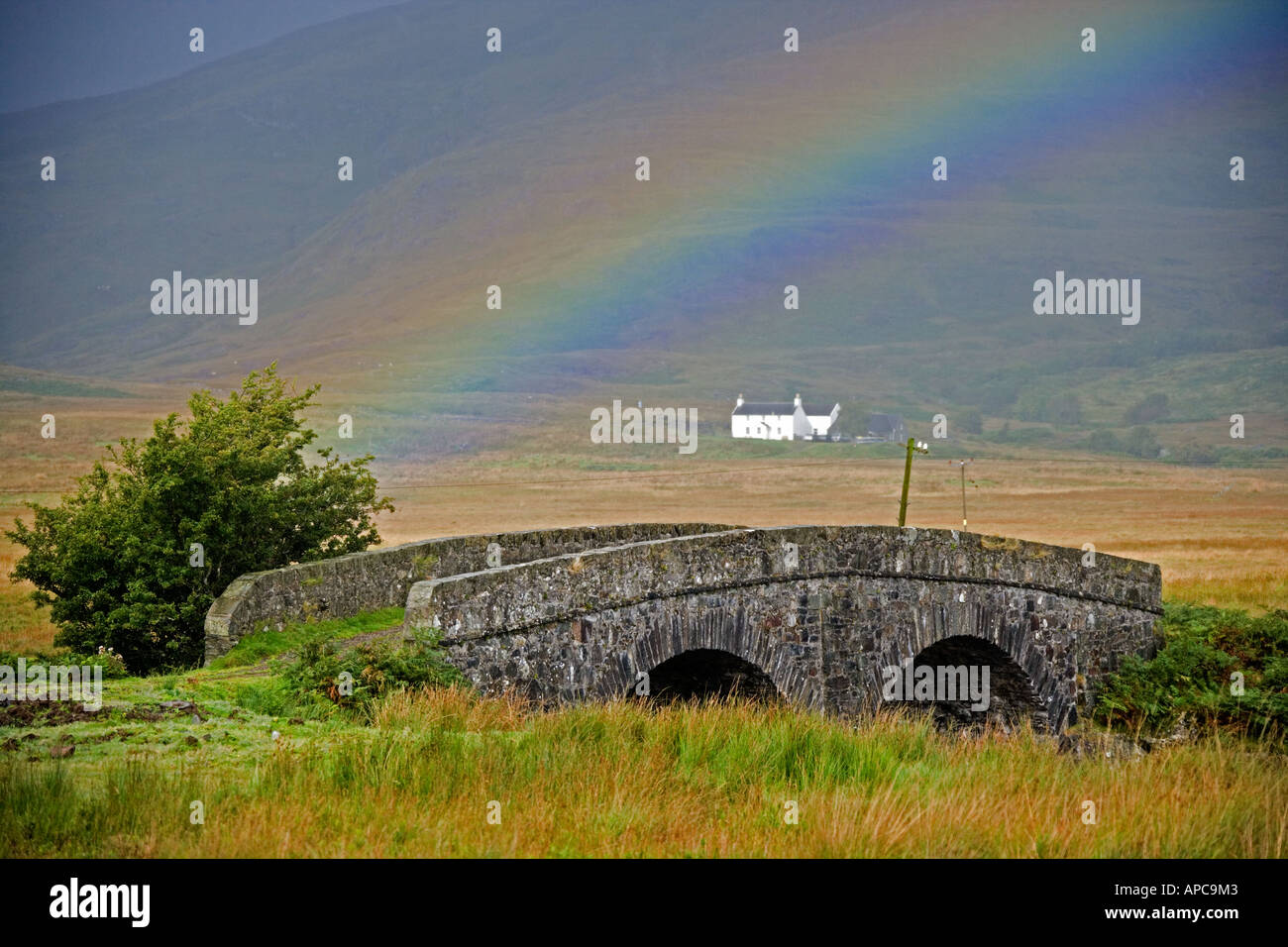 Rainbow over bridge Stock Photo - Alamy
