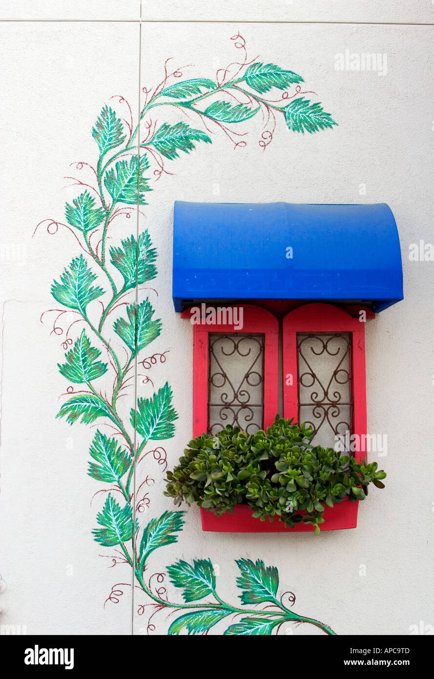 Faux Window Box And Leaf Mural photographed in a downtown shopiing area ...