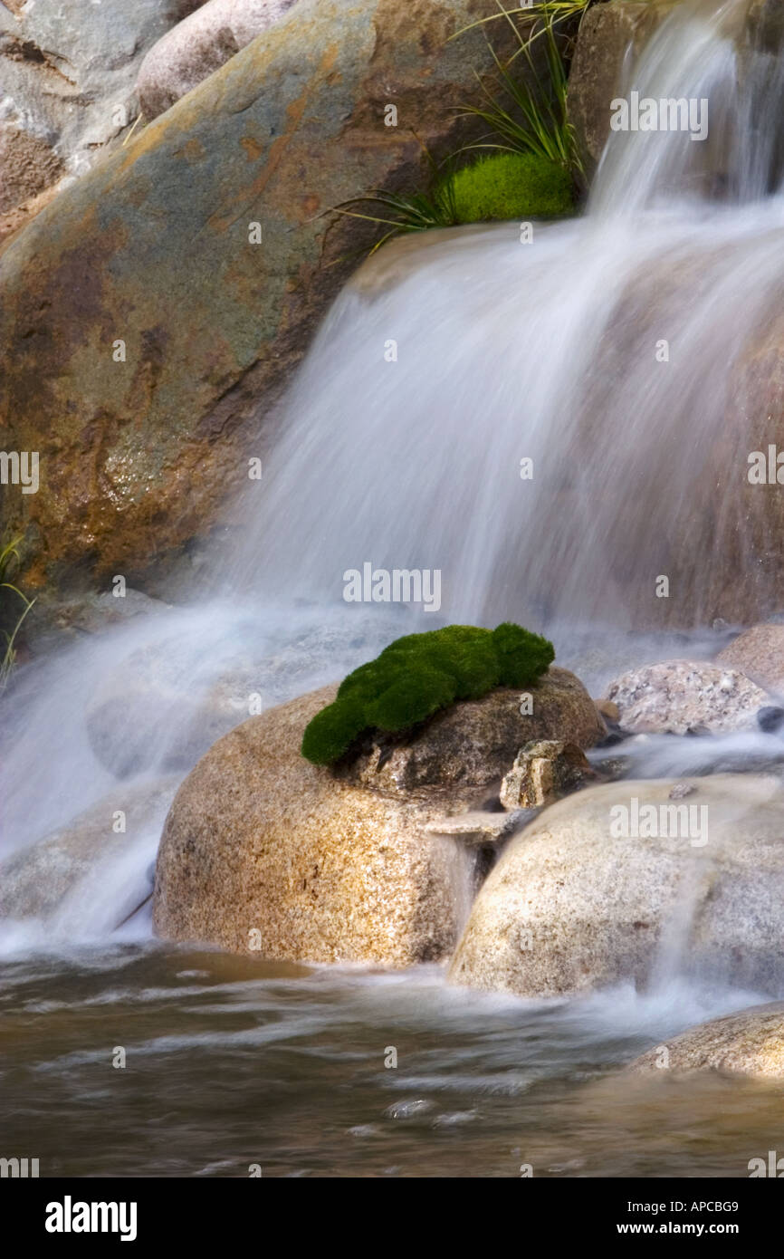 Garden Waterfall. Vertical. Taken with slow shutter speed to give the ...