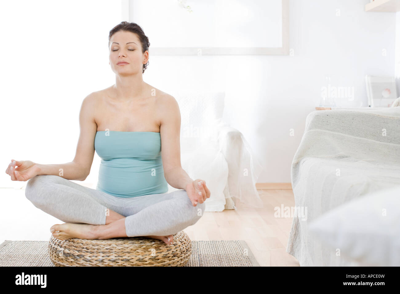 pregnant woman doing meditation Stock Photo - Alamy