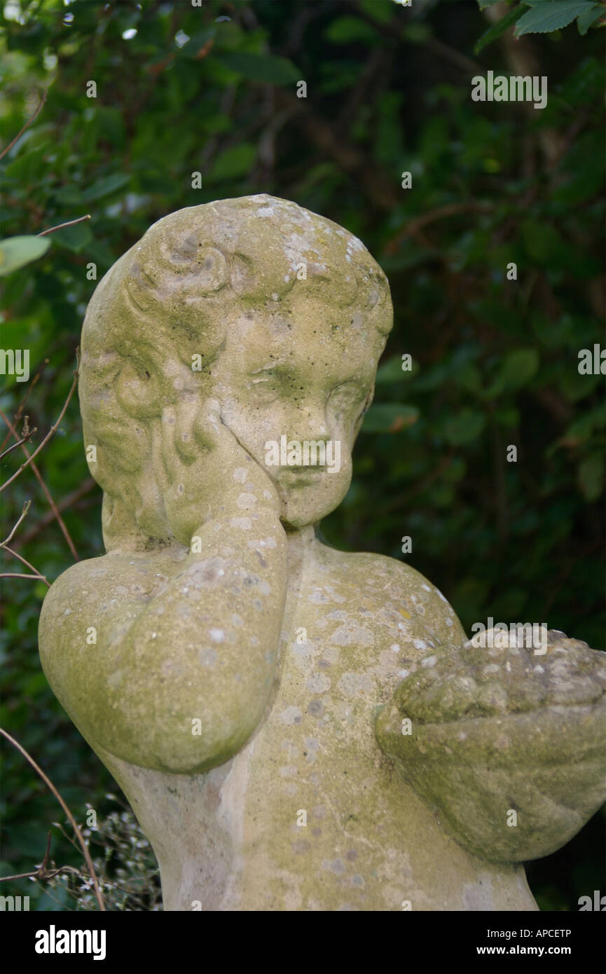 A garden statue of a wood nymph, in a Surrey Garden, England Stock ...