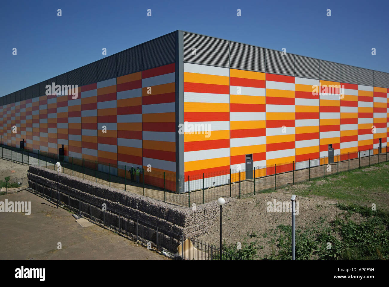 Bright colour cladding panel on windowless warehouse distribution ...