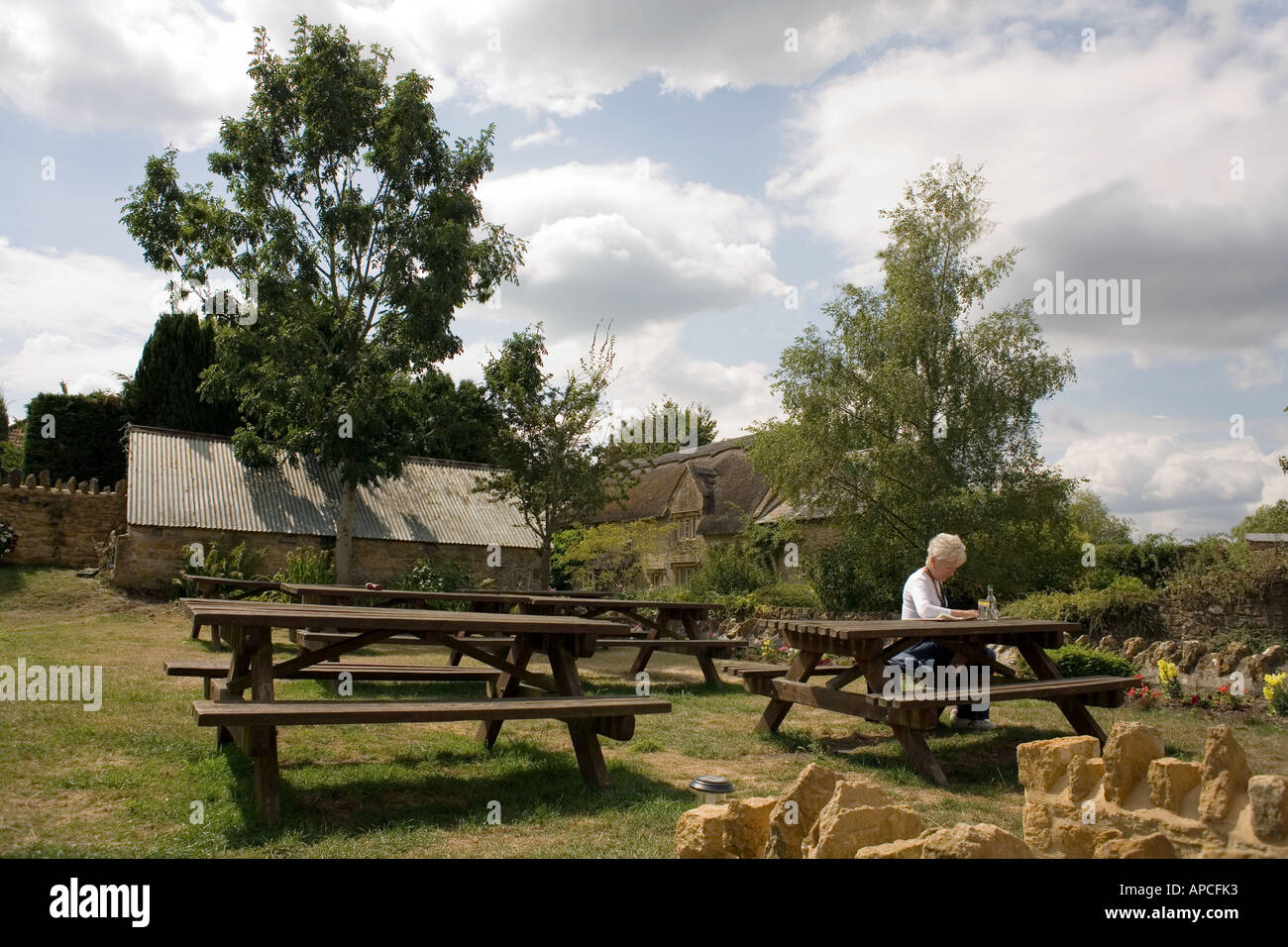 Woman Sitting On Pub Bench High Resolution Stock Photography and Images ...