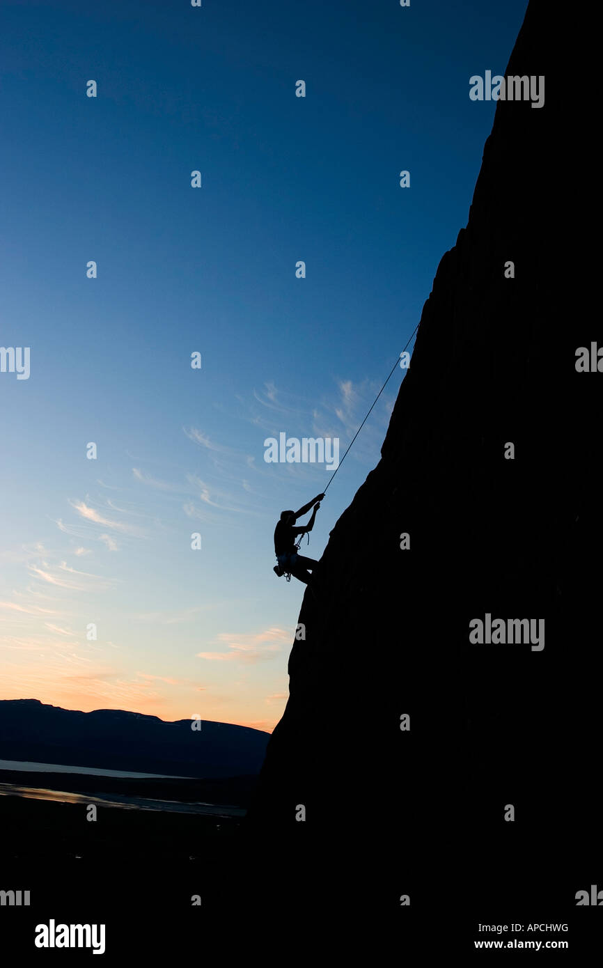 A man rappelling after a climb Stock Photo - Alamy