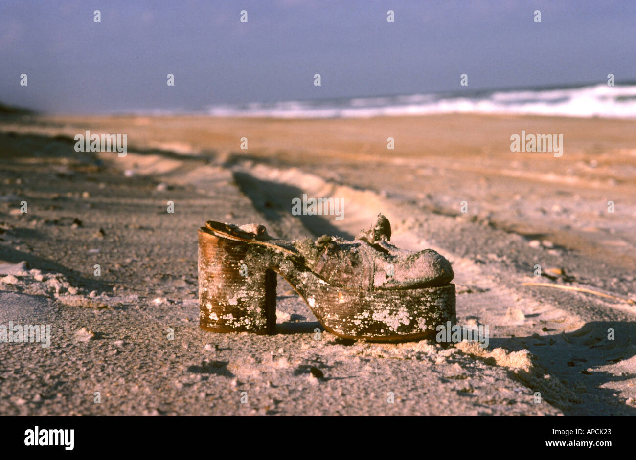 Broken platform shoe on beach Stock Photo - Alamy