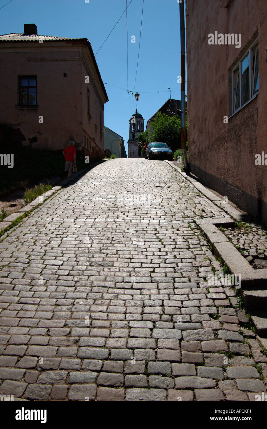 Street in Vyborg, bright cobblestone pavement highlighted with sun ...
