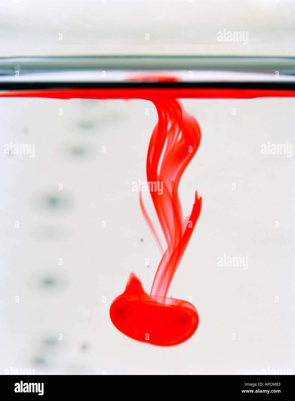 Red drop in water Stock Photo - Alamy