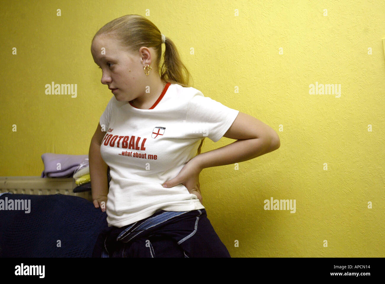 Moody teenaged girl looking sullen Stock Photo - Alamy
