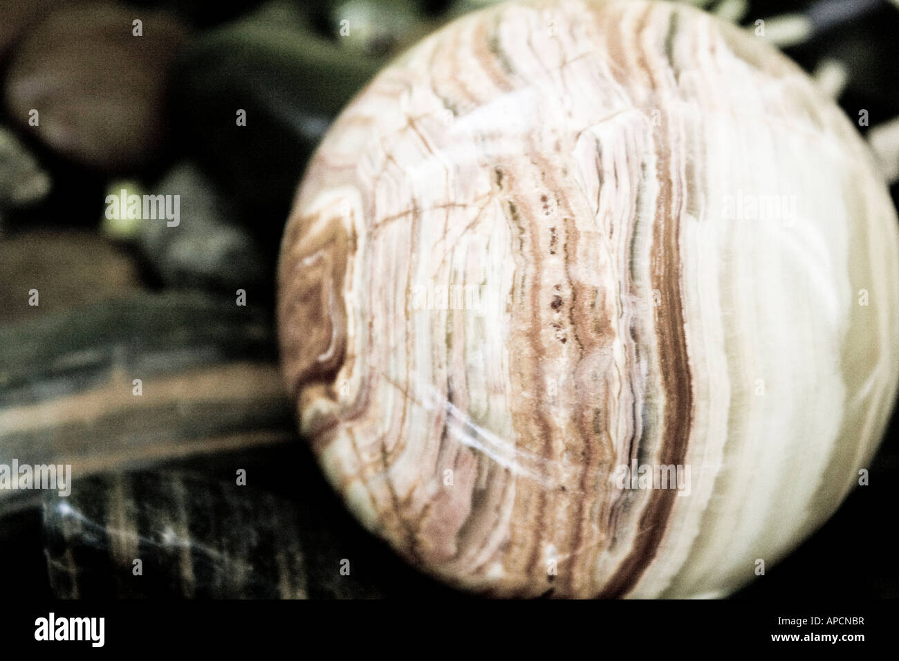A polished sphere of stone shows its varied texture Stock Photo - Alamy