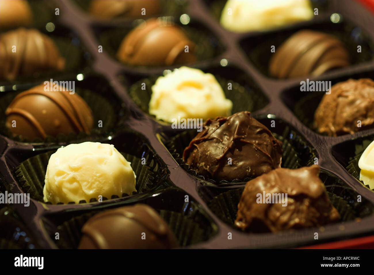 A mix of light milk & dark chocolates in a tray Stock Photo - Alamy