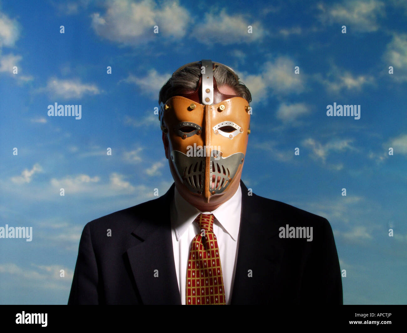 Businessman with scary mask Stock Photo - Alamy