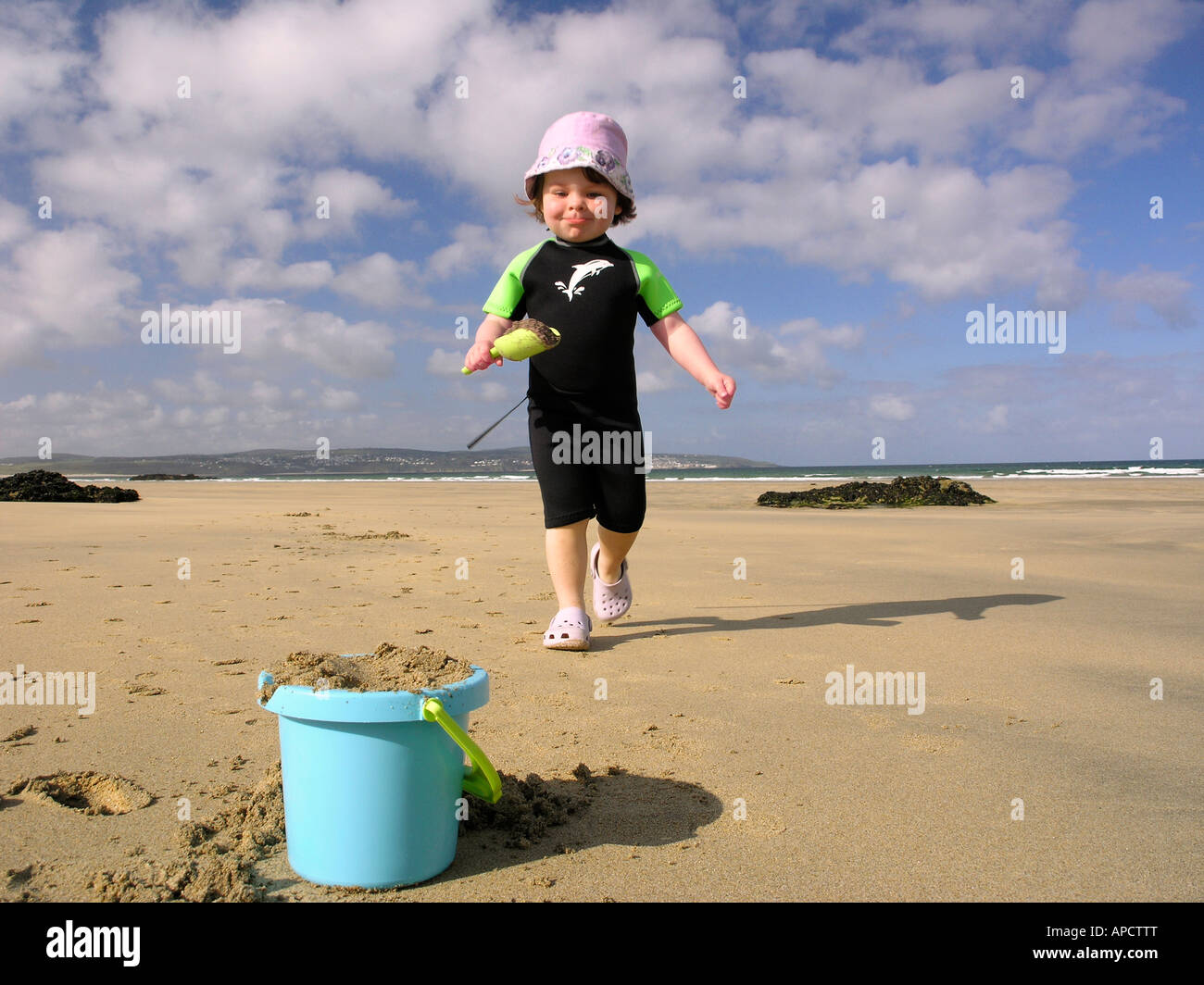 Toddler with bucket on the beach hi-res stock photography and images ...