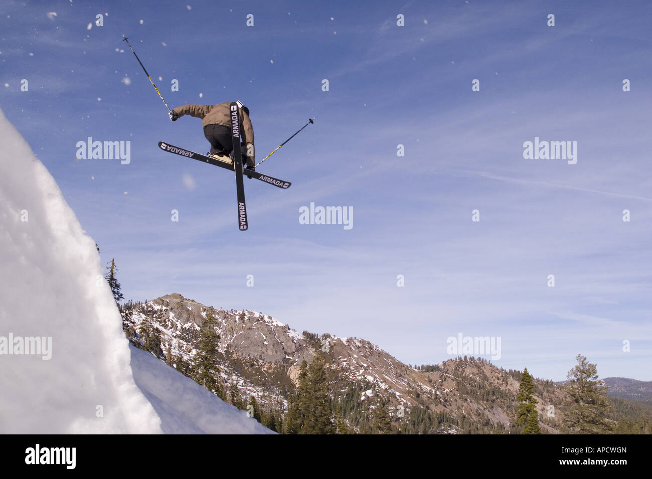 A skier doing a trick off a jump in the terrain park at the Alpine ...