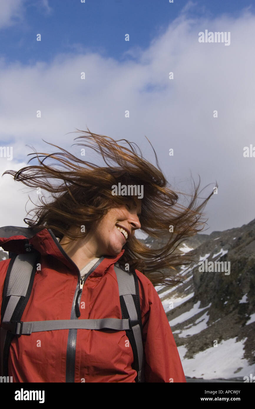 A woman tossing her hair while hiking near Chamonix France Stock Photo ...