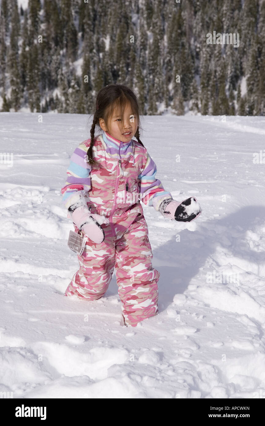 A young Korean girl throwing a snowball at Homewood ski area above Lake ...