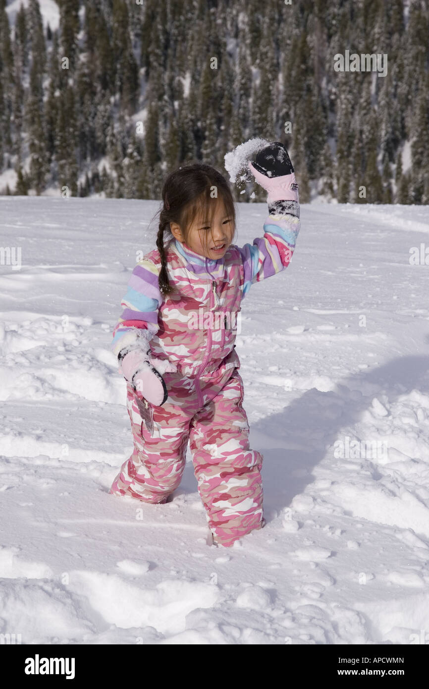 A young Korean girl throwing a snowball at Homewood ski area above Lake ...