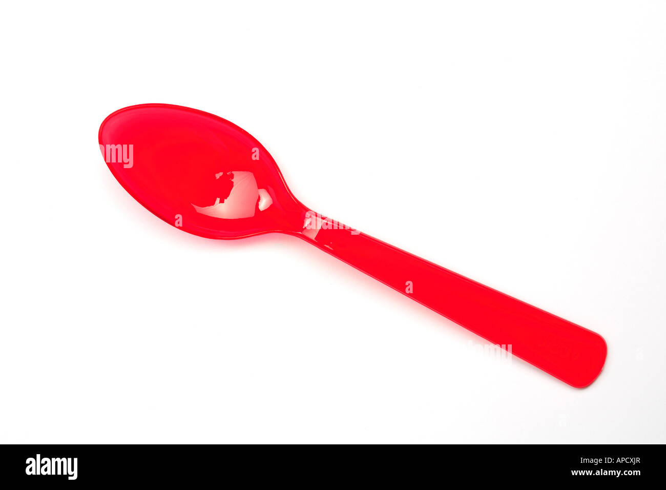 a red spoon made of plastic Stock Photo - Alamy