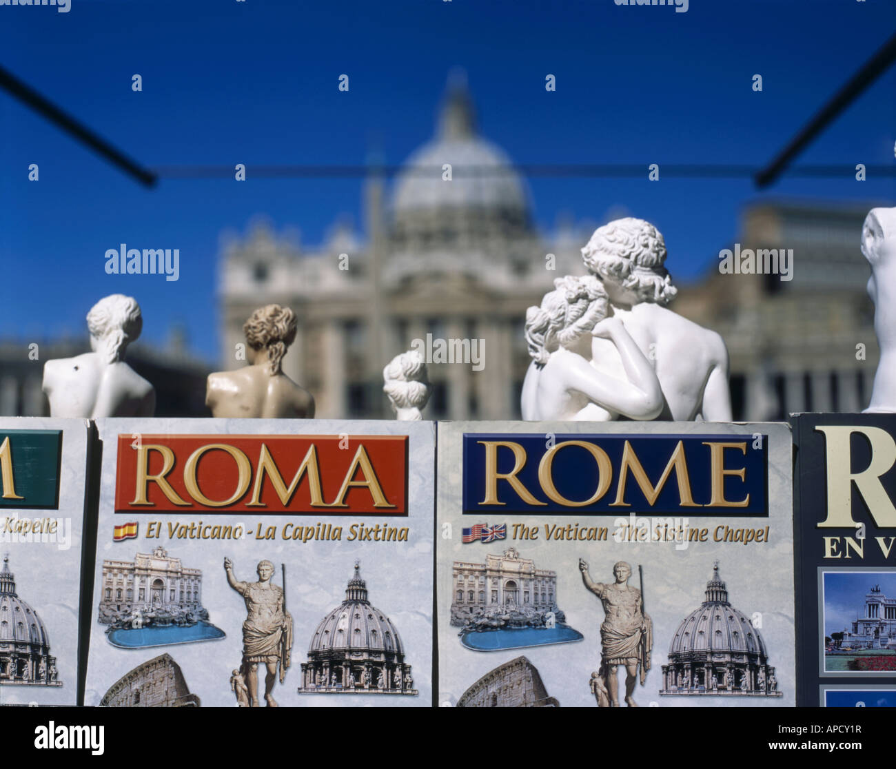 Book stall with guides on Rome and souvenir statues in front of St ...