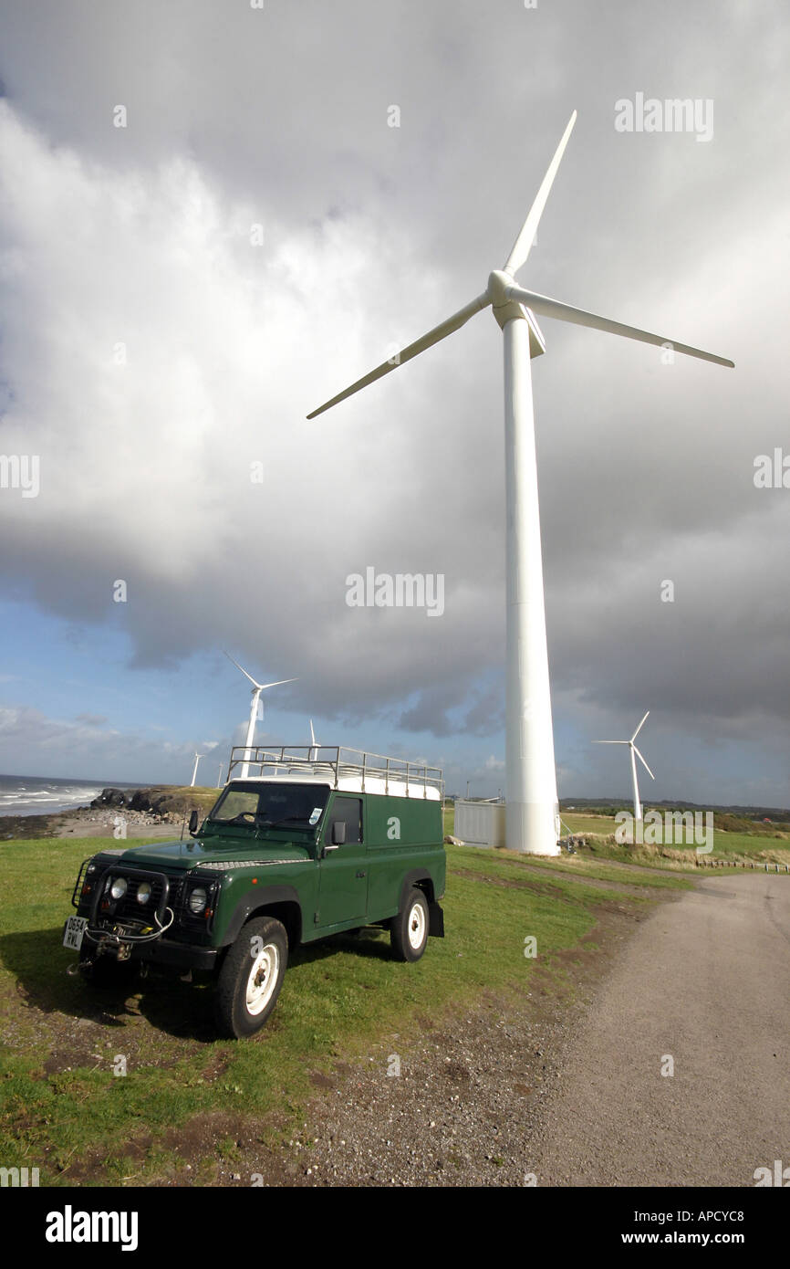 range rover next to wind turbine, uk Stock Photo - Alamy