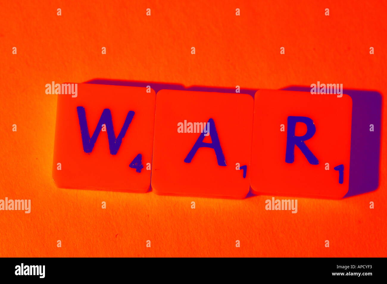 war spelt out with letters on a red background Stock Photo - Alamy