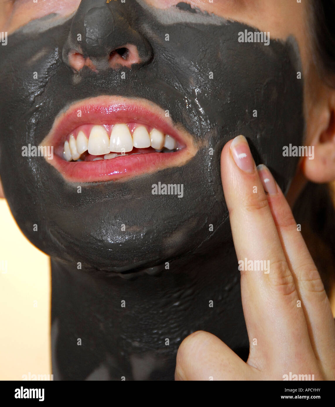 Mud face mask Stock Photo - Alamy