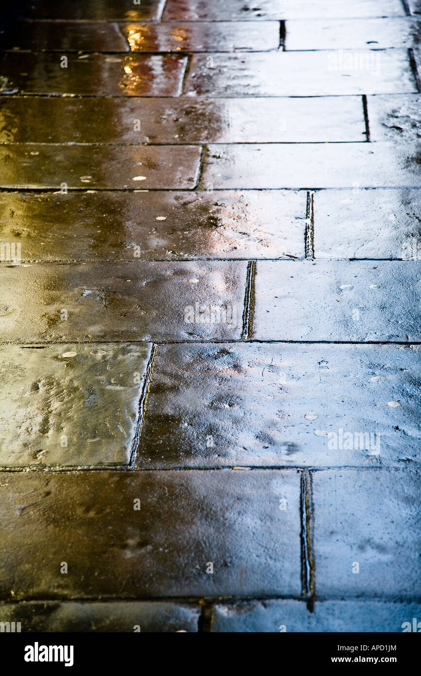 Reflections in the pavement on a wet day, Surrey, England Stock Photo ...