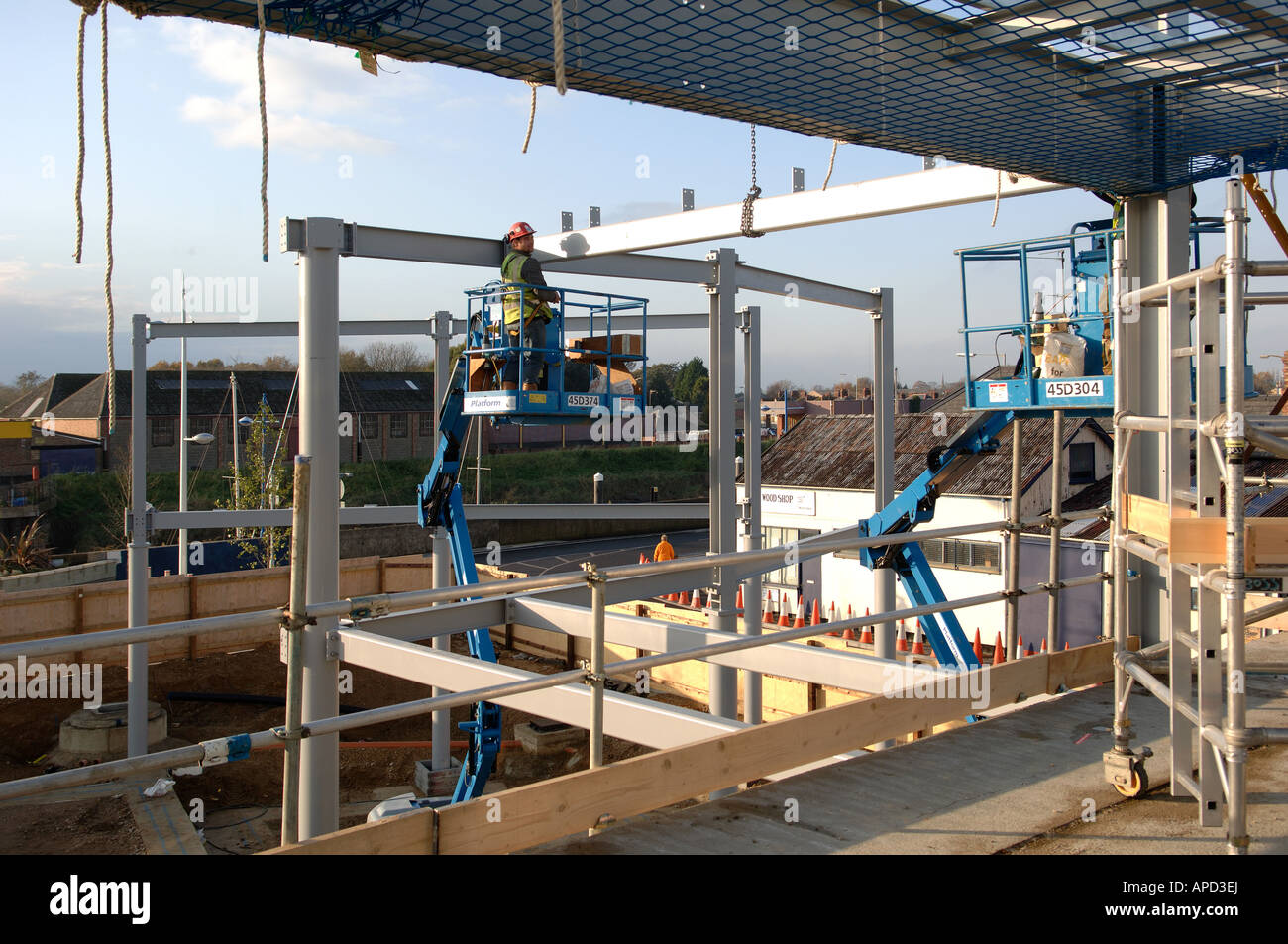 Construction workers lining up steel girder on steel fabricated ...