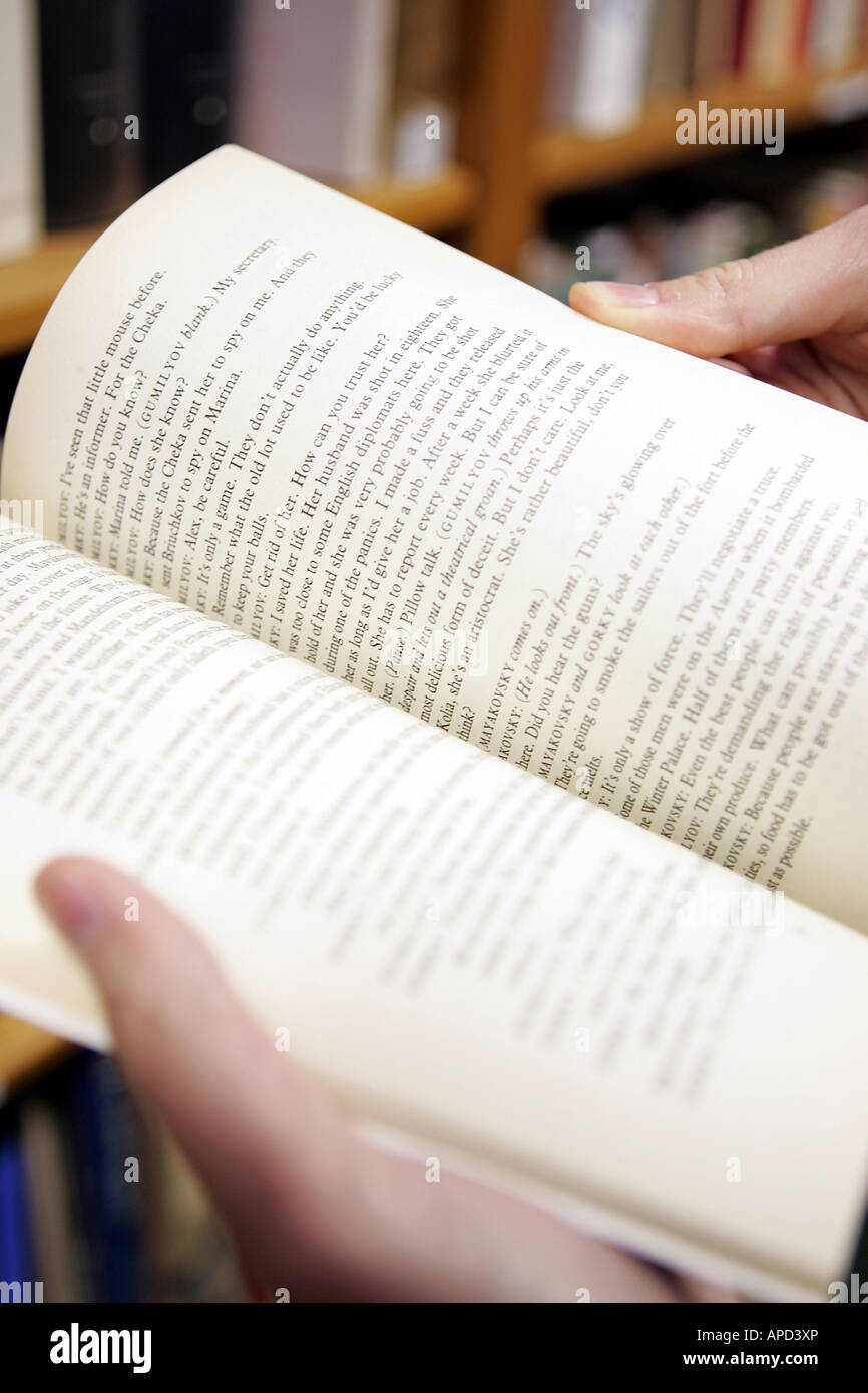 Looking At Or Reading A Book Stock Photo - Alamy