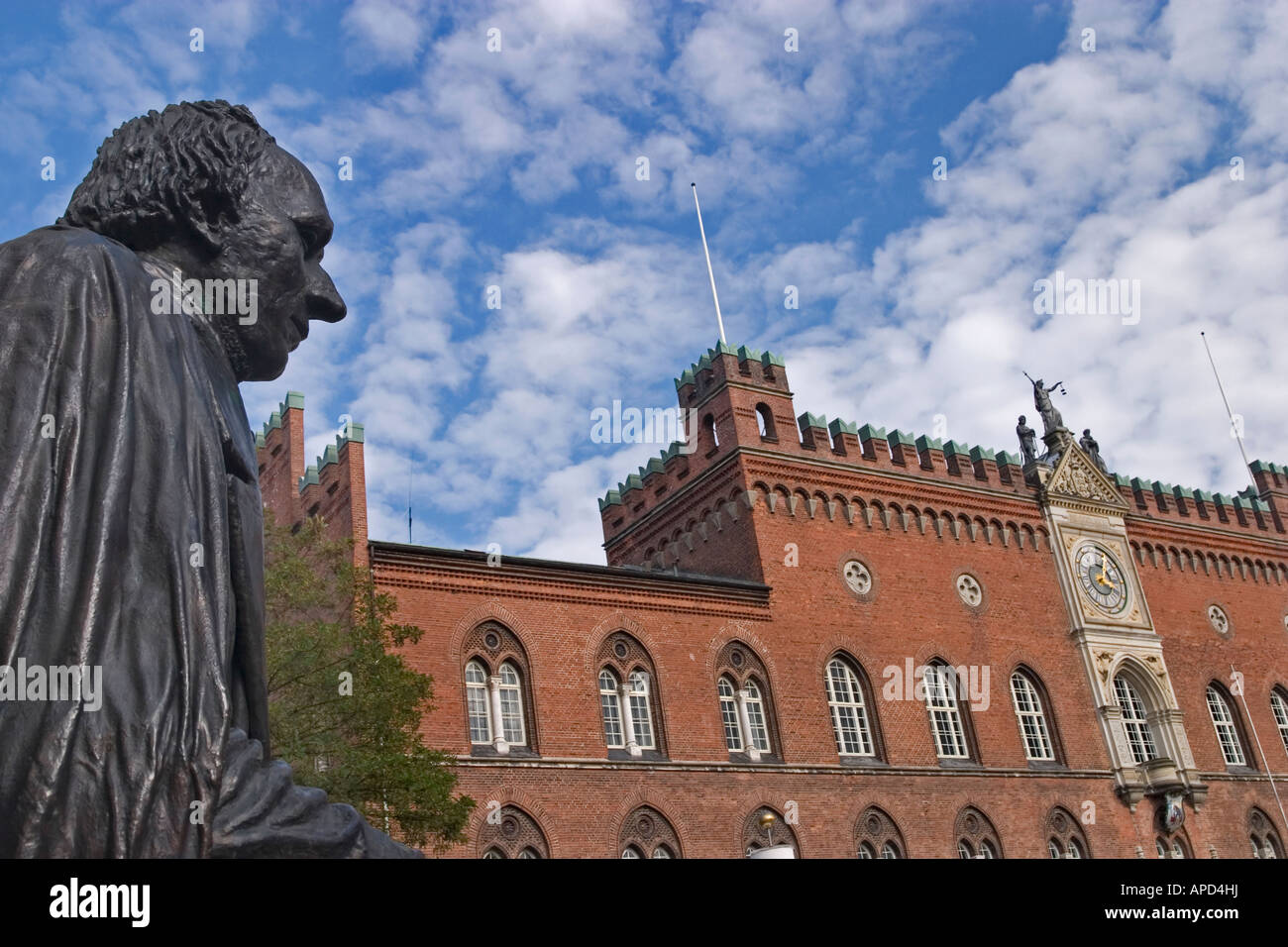 The statue of H C Andersen overlooking the gothic styled town hall ...