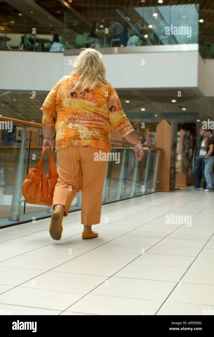 Overweight woman in shopping mall Stock Photo - Alamy