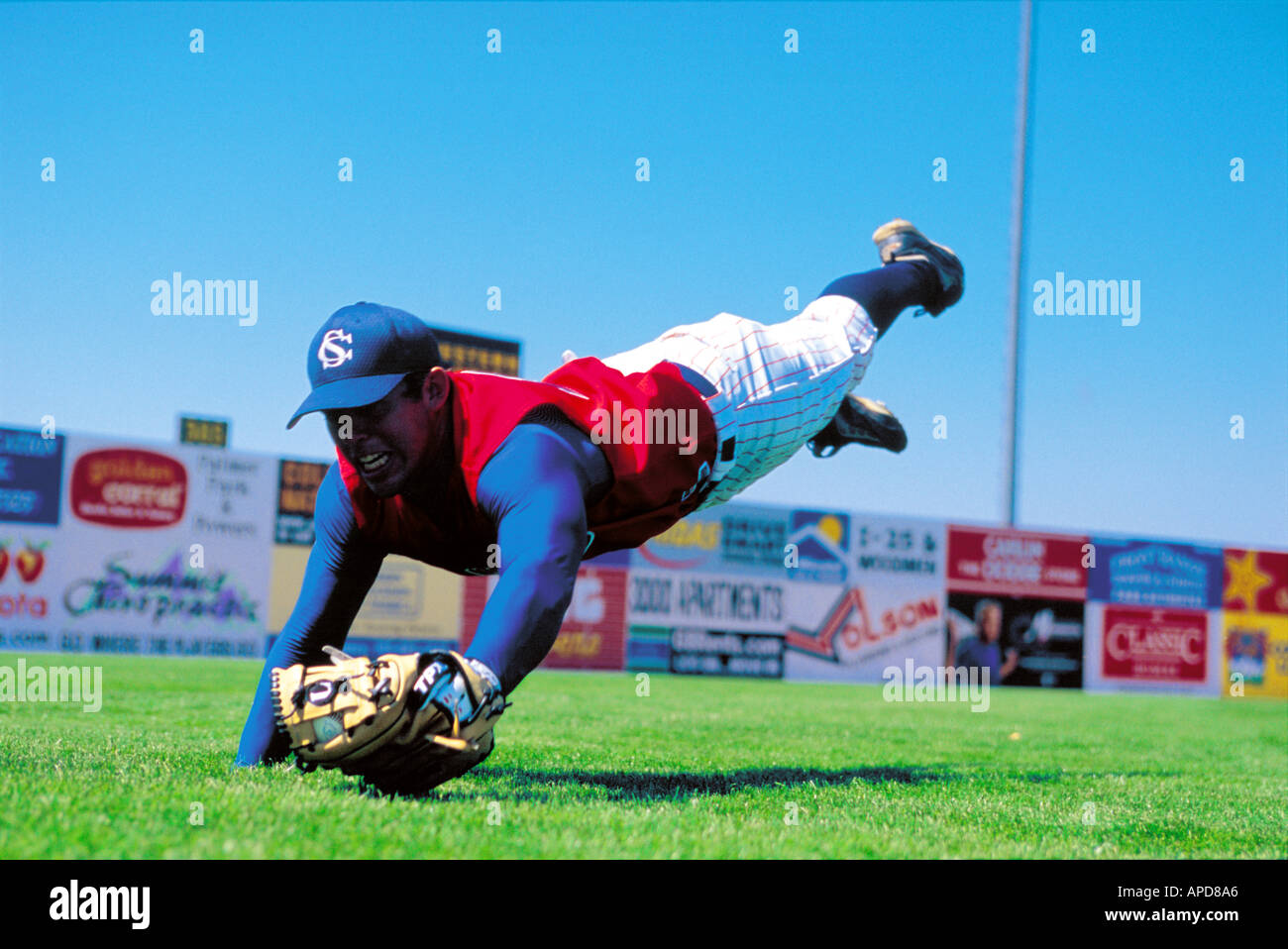 Playing baseball catcher jumping catch hi-res stock photography and ...