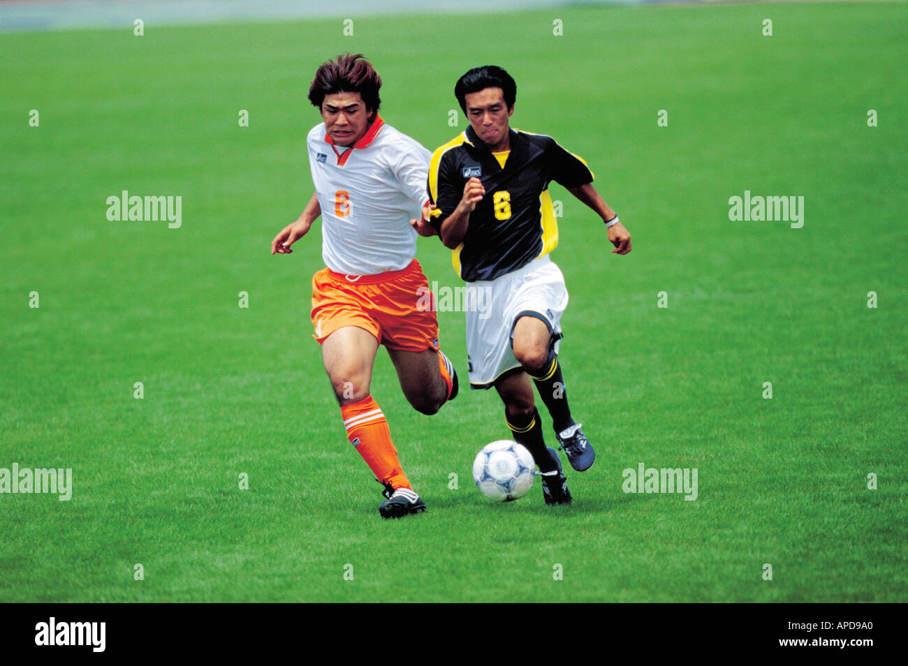 Professional football chasing ball hi-res stock photography and images ...