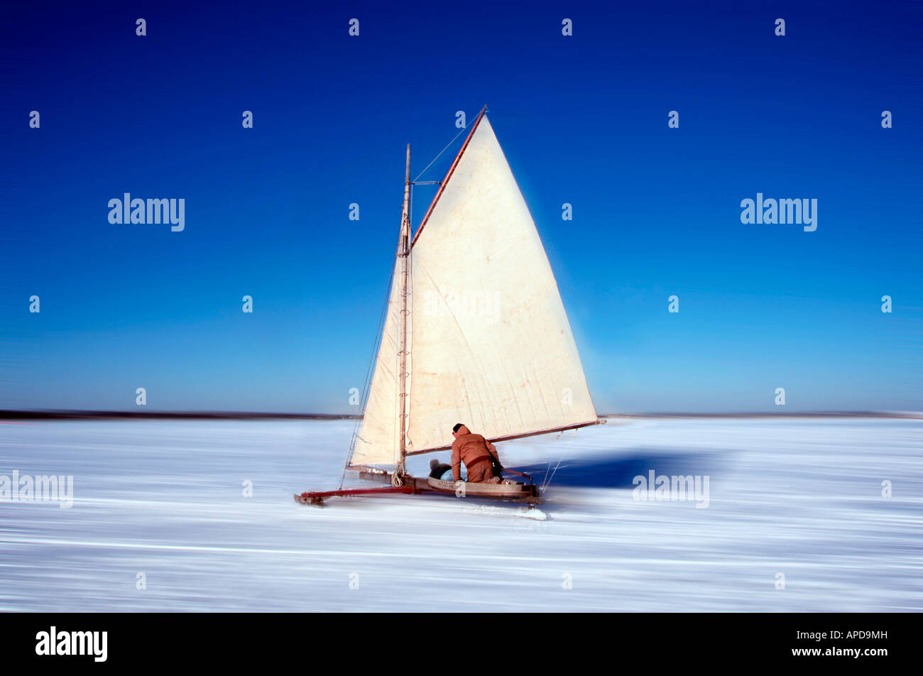 Iceboating in antique Penguin boat Stock Photo - Alamy