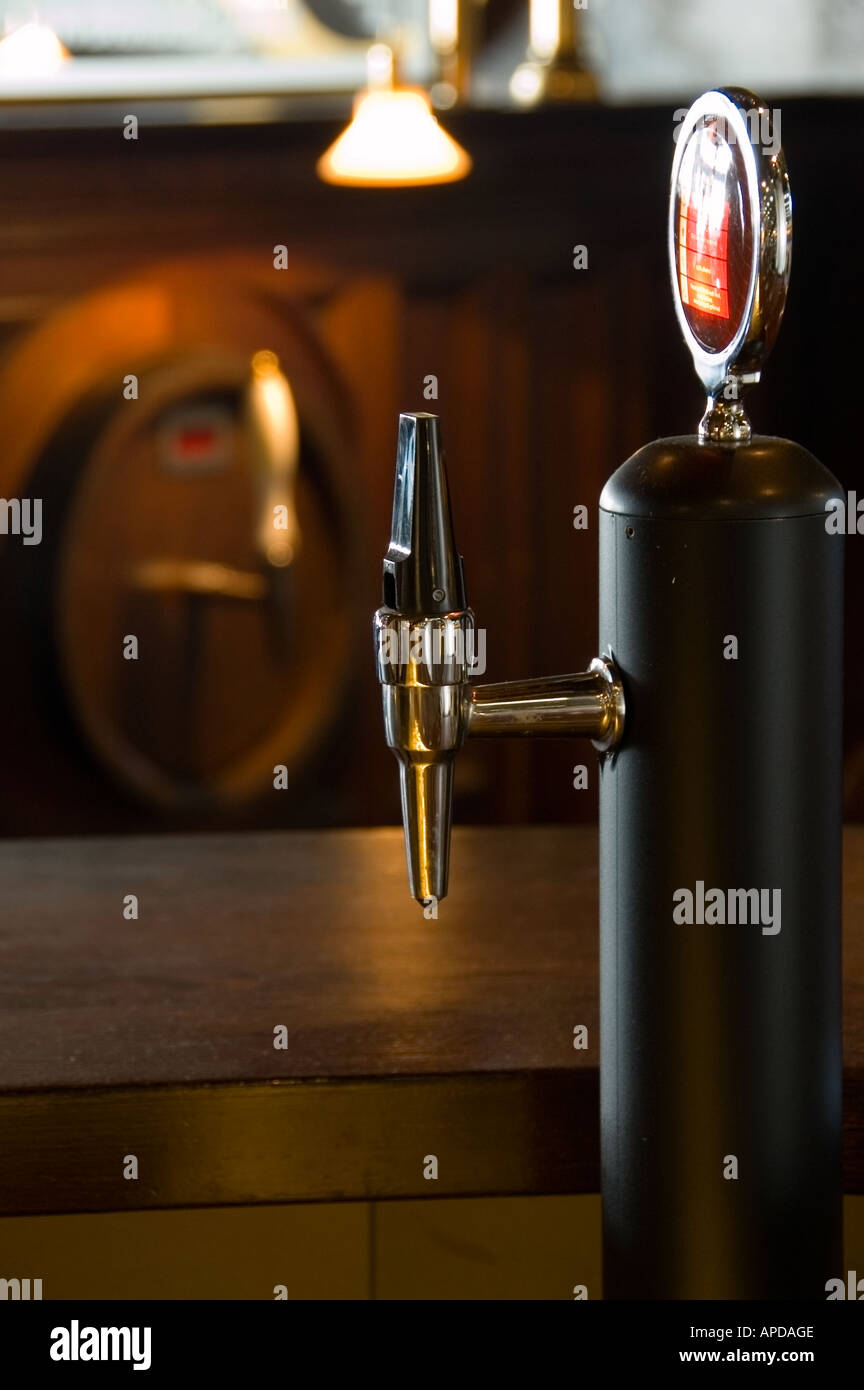 Modern Beer Tap with Traditional Beer Tap in the background Stock Photo ...