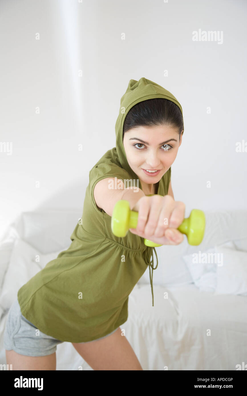 woman lifting up dumbbells Stock Photo - Alamy