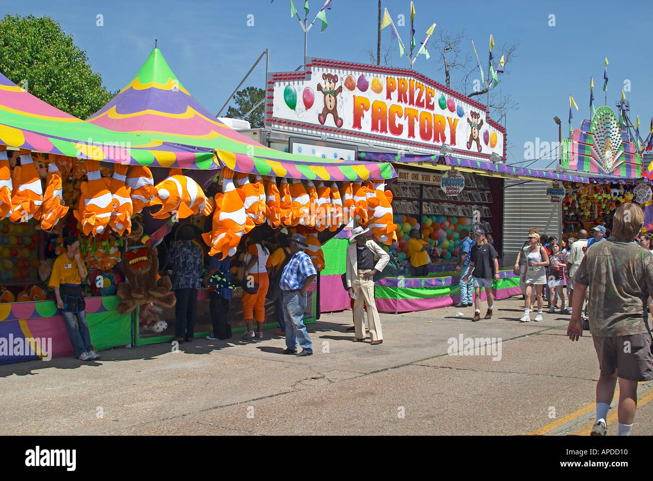 A row of colorful stuffed fish at a carnival Stock Photo - Alamy