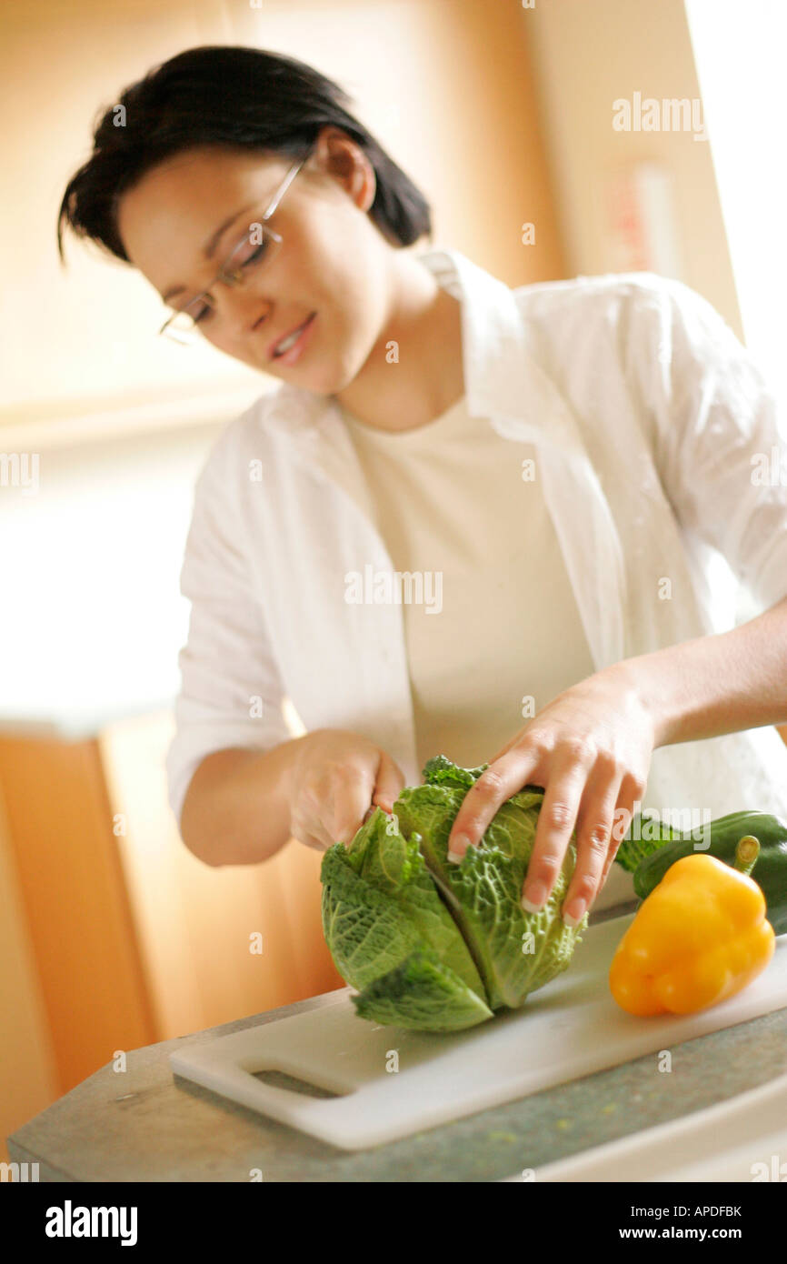 woman chopping cabbage Stock Photo - Alamy