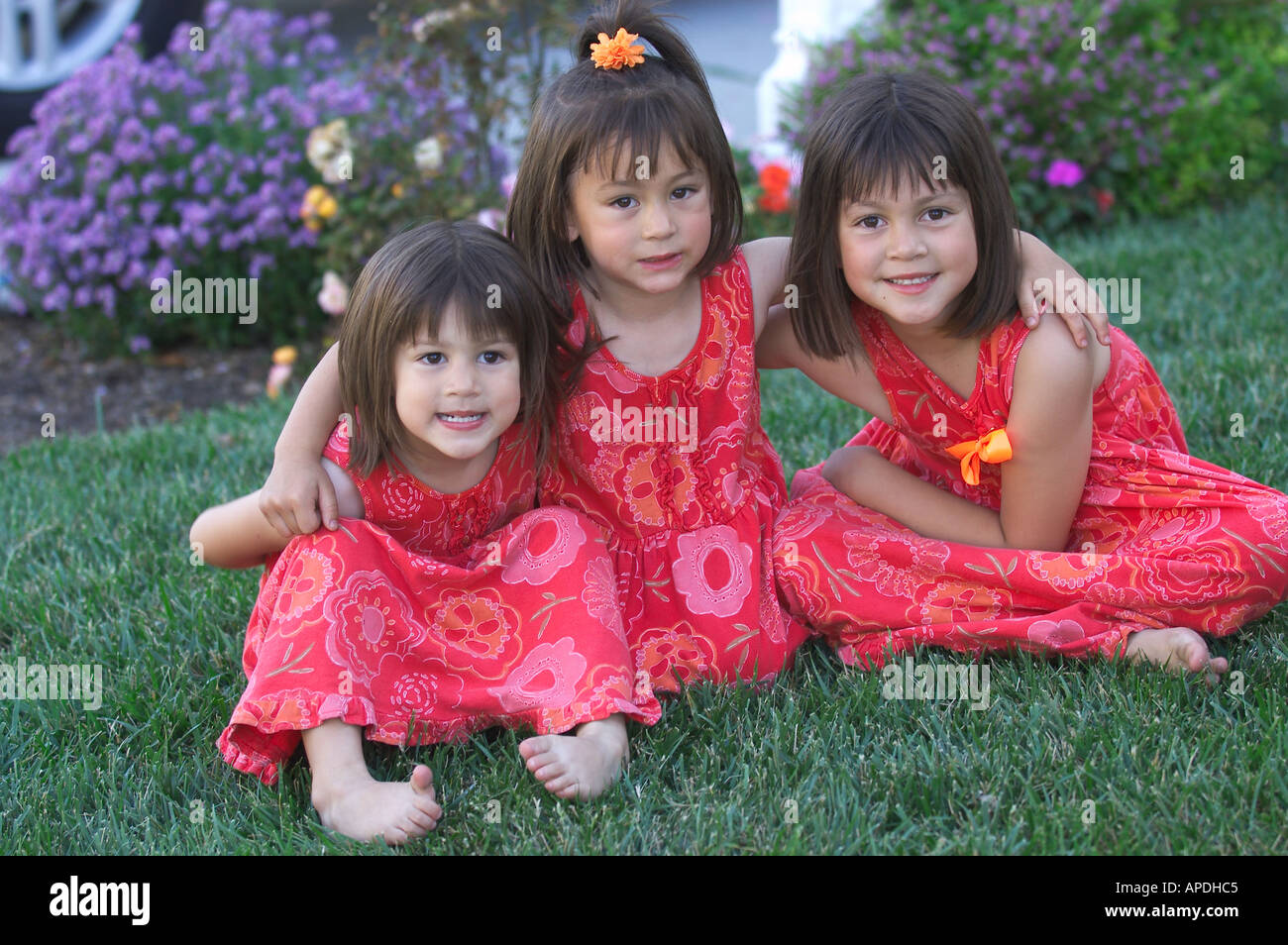 three young sisters wearing same dresses Stock Photo - Alamy three young sisters wearing same dresses Stock Photo - Alamy