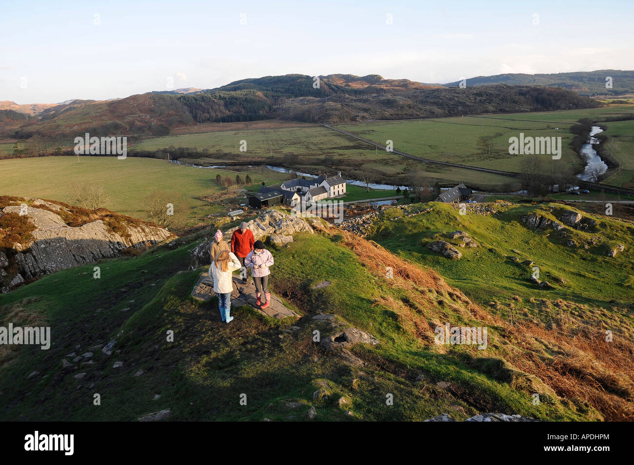 Descending from the hill at Dunadd four hikers have visited the ancient ...