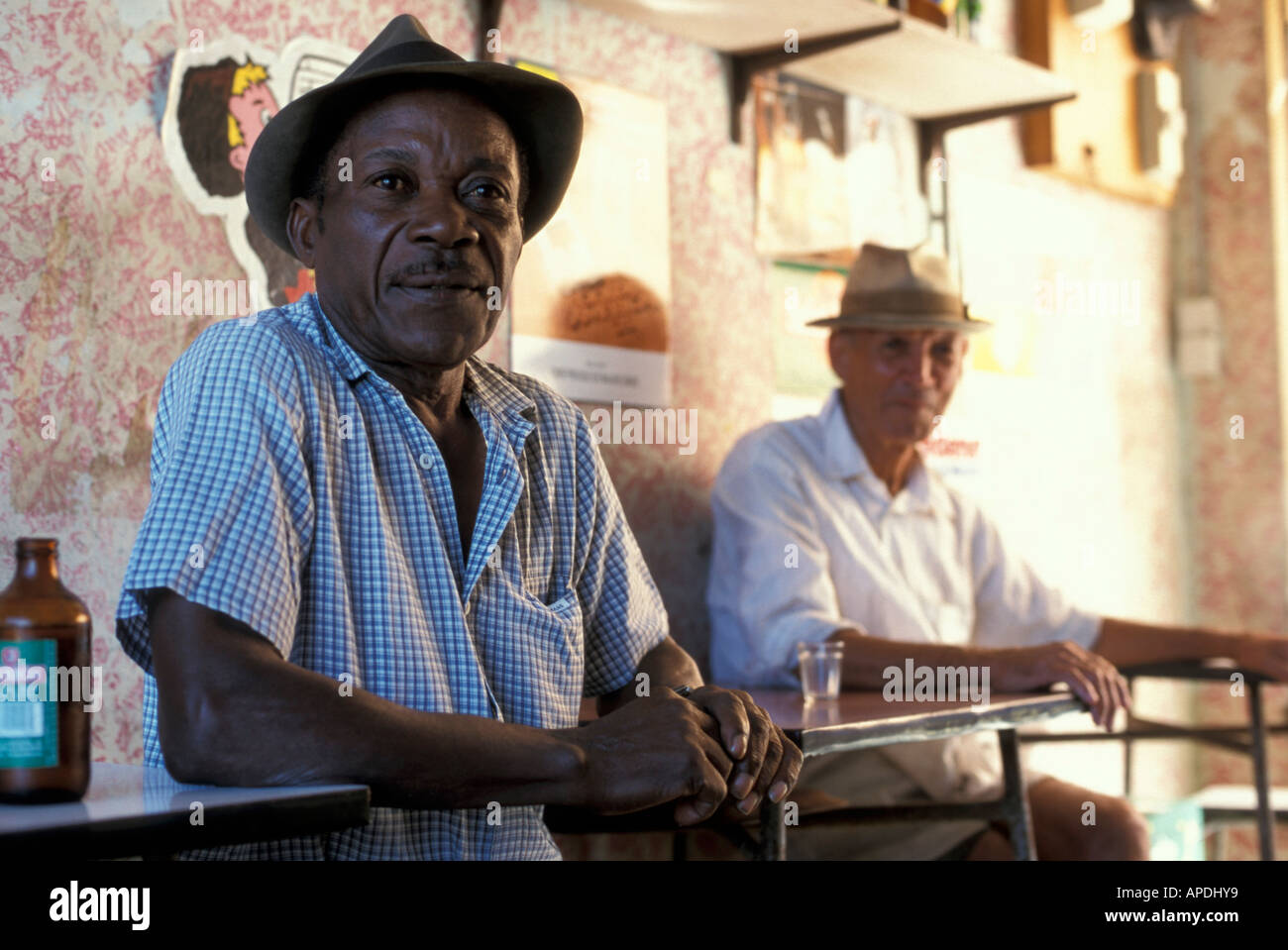 Two men sitting in a bar in St. Pierre, La Réunion, Indian Ocean Stock ...