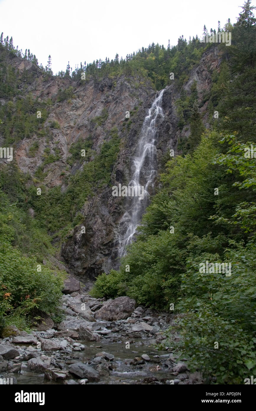 A waterfall flows over a cliff in the forests of Quebec Stock Photo - Alamy