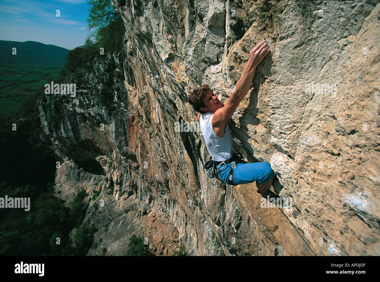 Climber Matej Sova climbing on small holds high on the wall of Misja ...