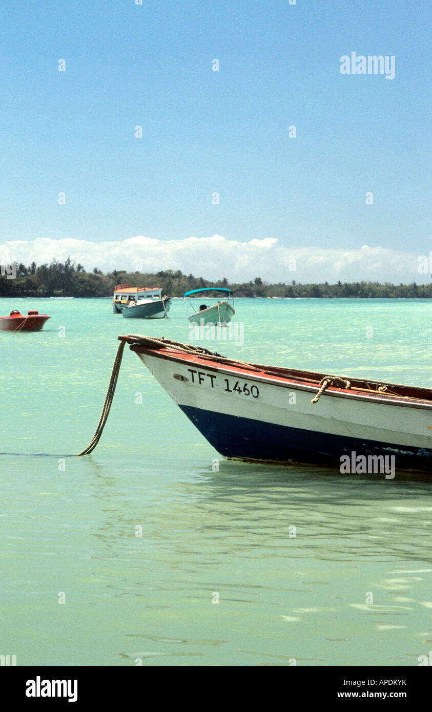 Local fishing boat moored in the turquoise waters of Tobago Stock Photo ...
