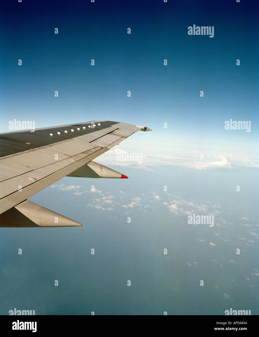 View from aeroplane window of wing and clouds Stock Photo - Alamy