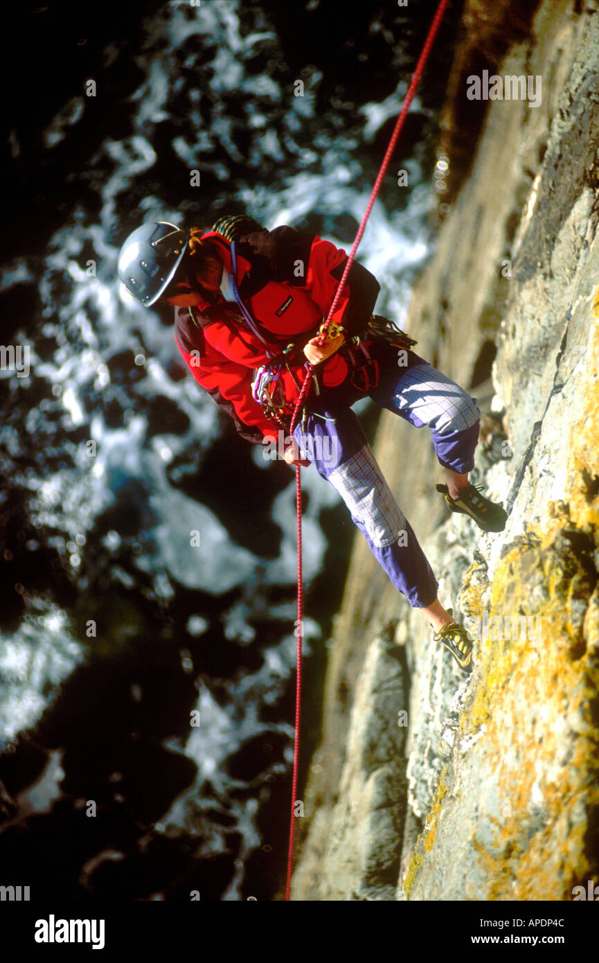 Abseiling to the base of a sea cliff Stock Photo - Alamy